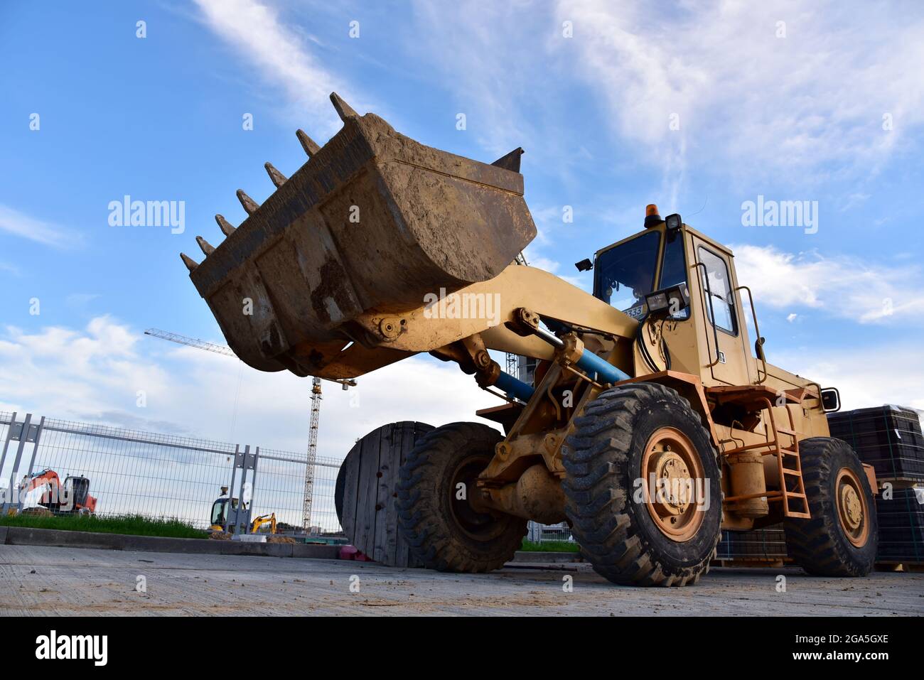 Wheel loader with a bucket at construction. Heavy machinery for loading ...