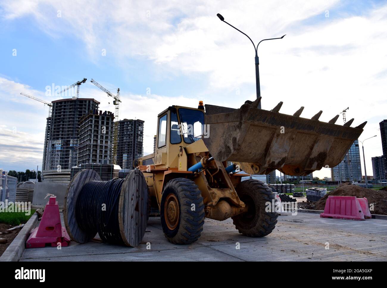 Wheel loader with a bucket at construction. Heavy machinery for loading ...