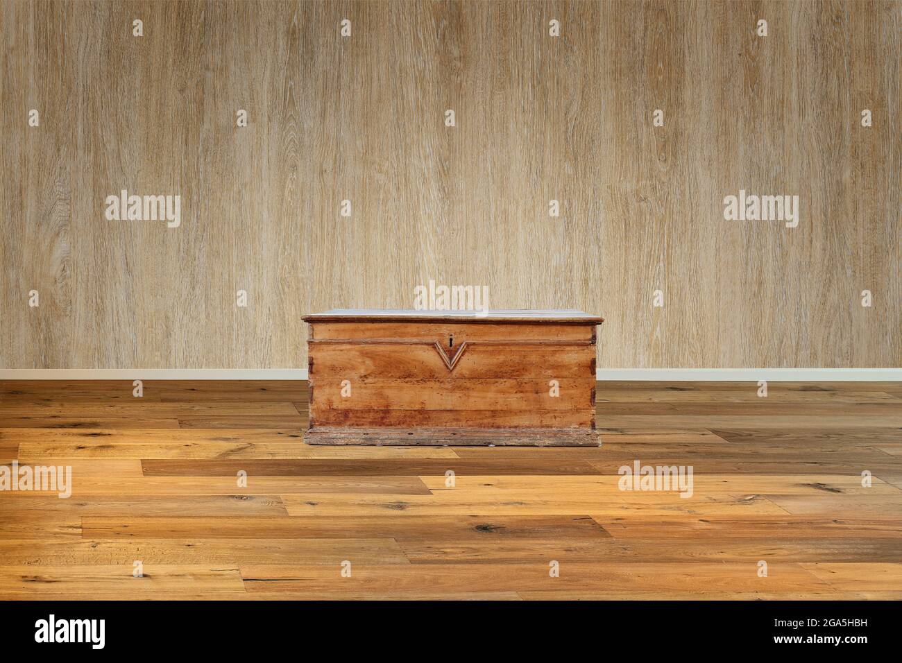 Old-fashioned wooden chest against textured wood wall . Large copy ...