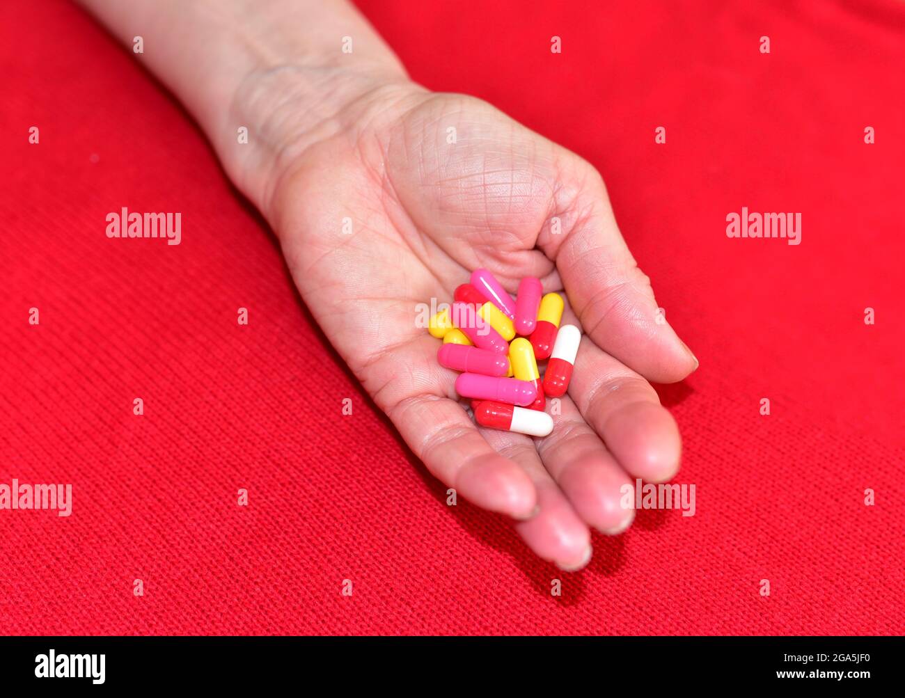 Pills in capsules in female hand. Medicine grade pharmaceutical tablets ...