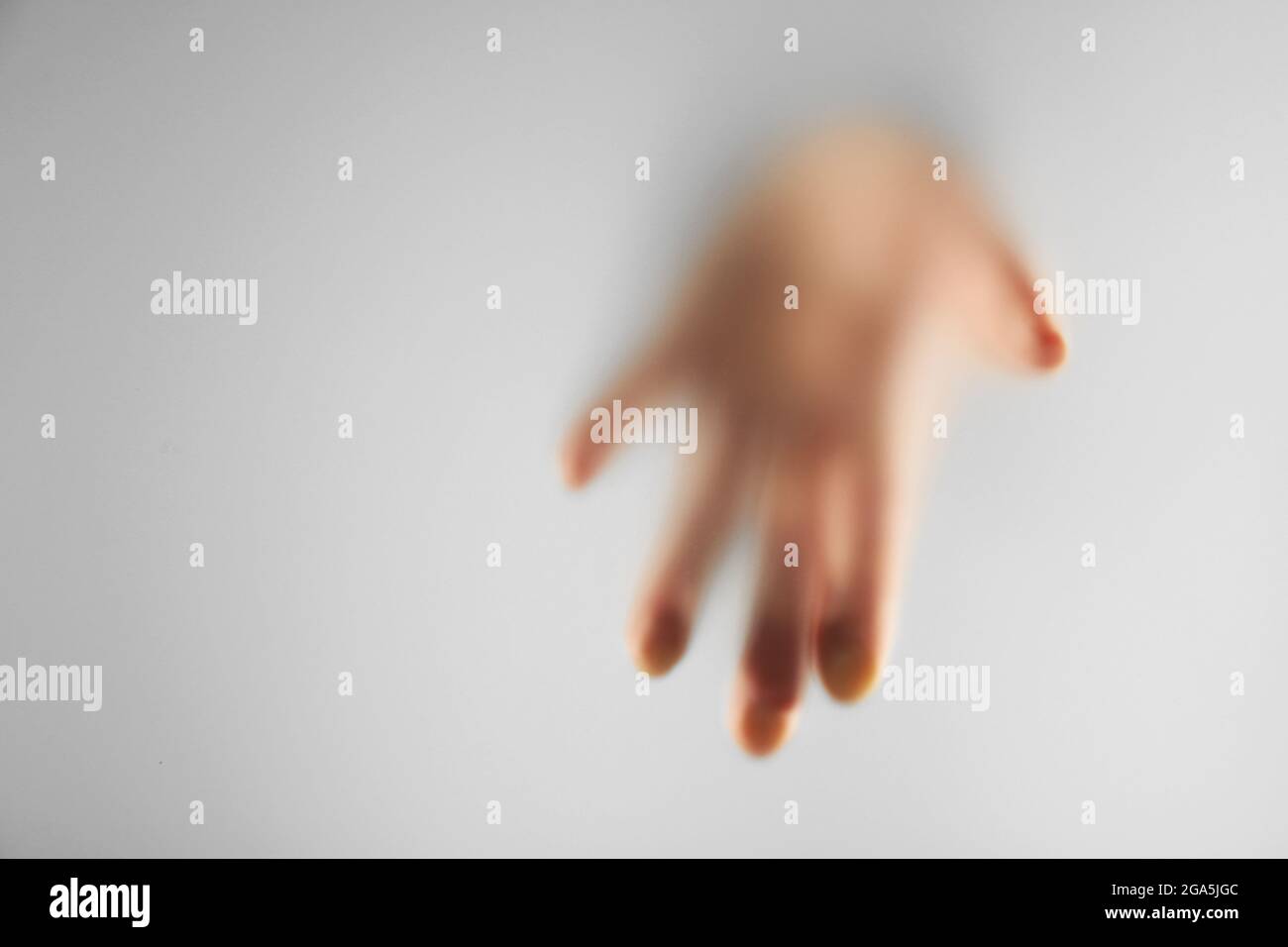 Hand silhouettes behind glass foreground Stock Photo - Alamy
