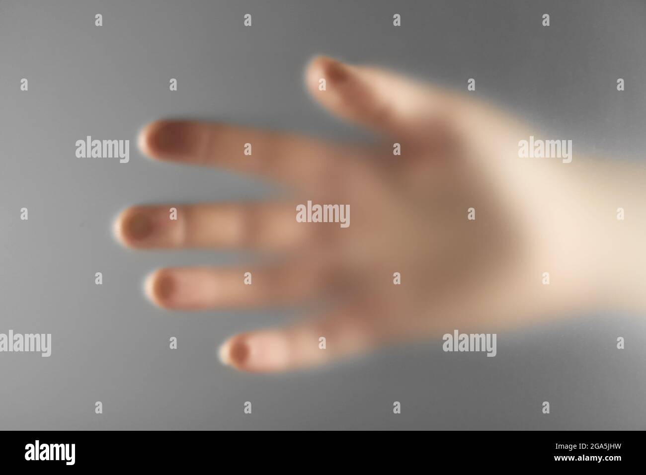 Hand silhouettes behind glass foreground Stock Photo - Alamy