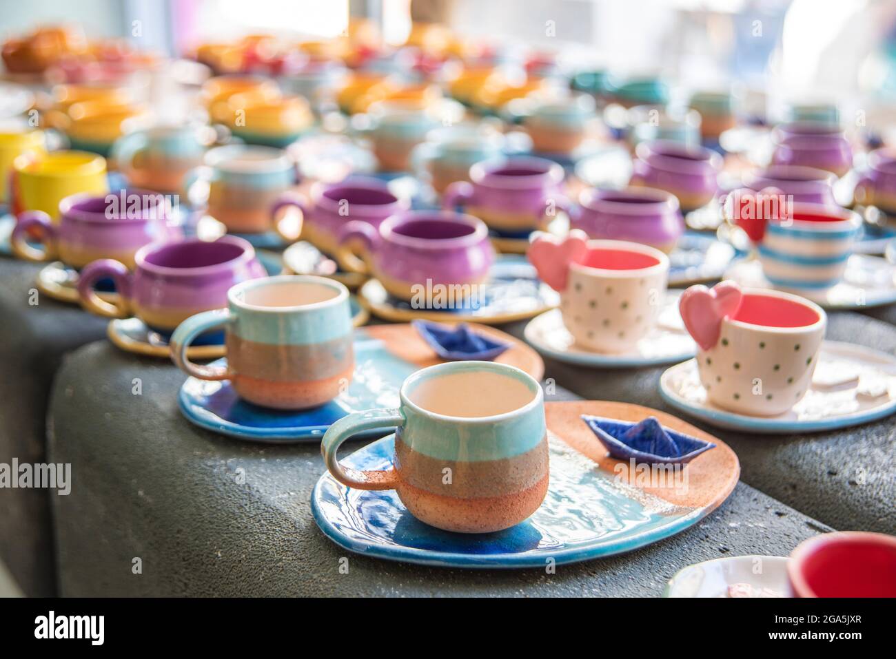 ceramic coffee cups with boat figure Stock Photo - Alamy