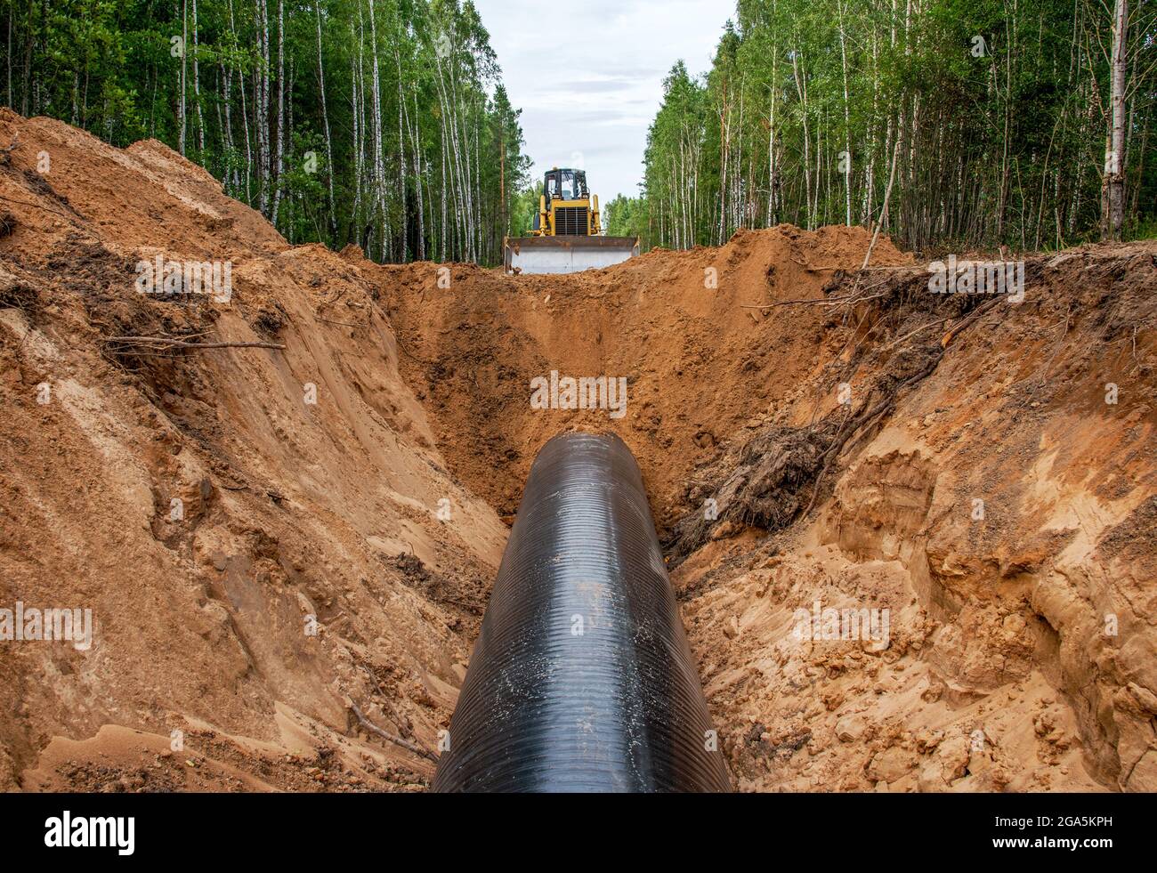 Natural Gas Pipeline Construction. Dozer on earthworks while laying a ...