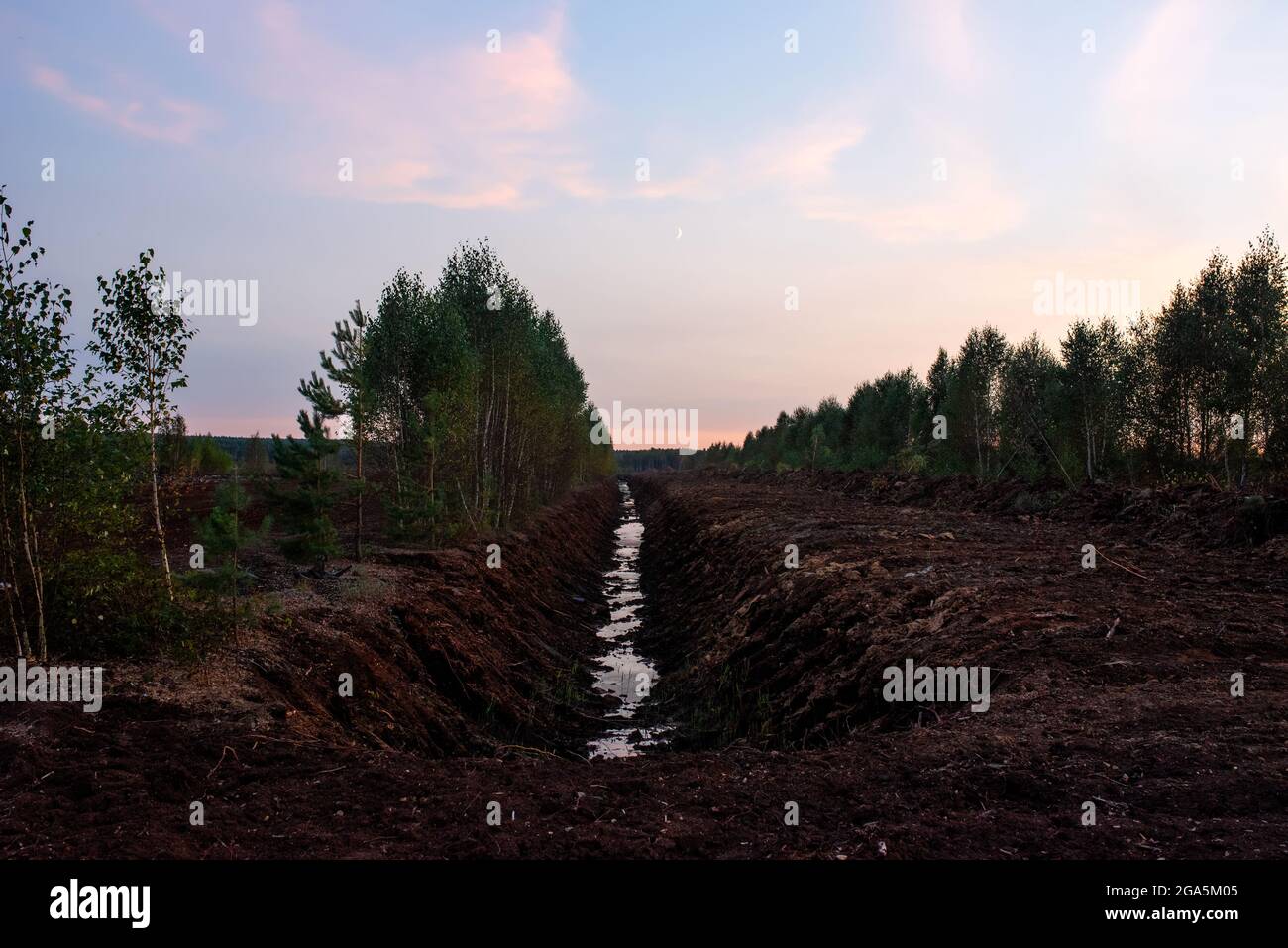 Drainage ditch in the peat extraction site. Drainage and destruction of ...