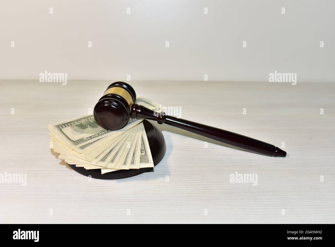 Judge hammer and bundles of dollars. Justice in courtroom. Mallet of ...