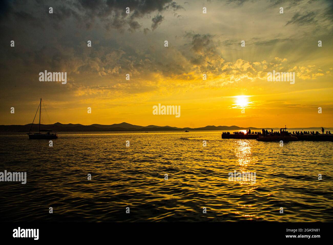 Sunset of orange and yellow colors in the city of Zadar on the Adriatic ...