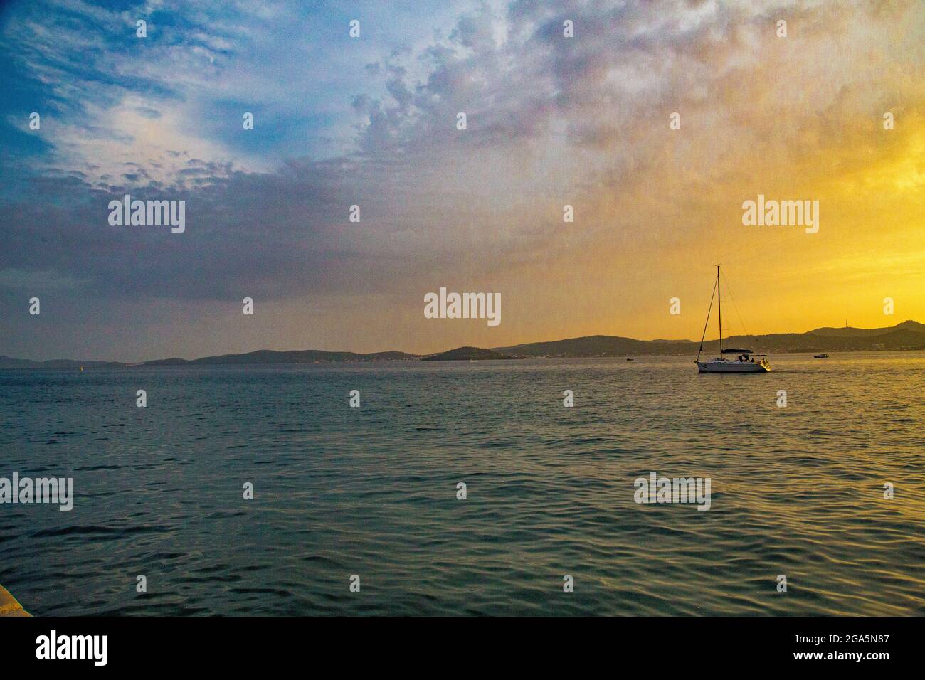 Sunset of orange and yellow colors in the city of Zadar on the Adriatic ...