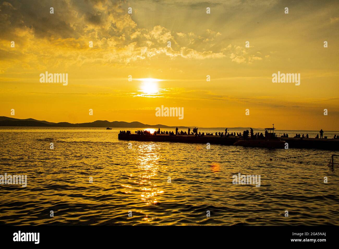 Sunset of orange and yellow colors in the city of Zadar on the Adriatic ...
