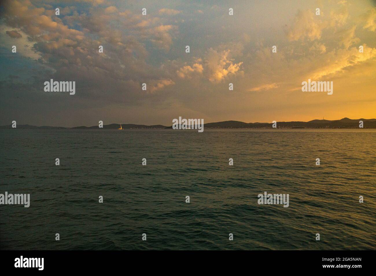 Sunset of orange and yellow colors in the city of Zadar on the Adriatic ...