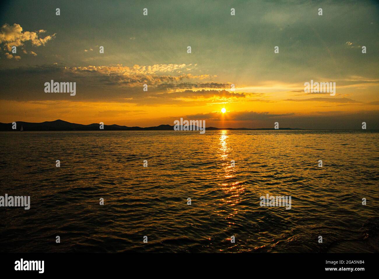 Sunset of orange and yellow colors in the city of Zadar on the Adriatic ...