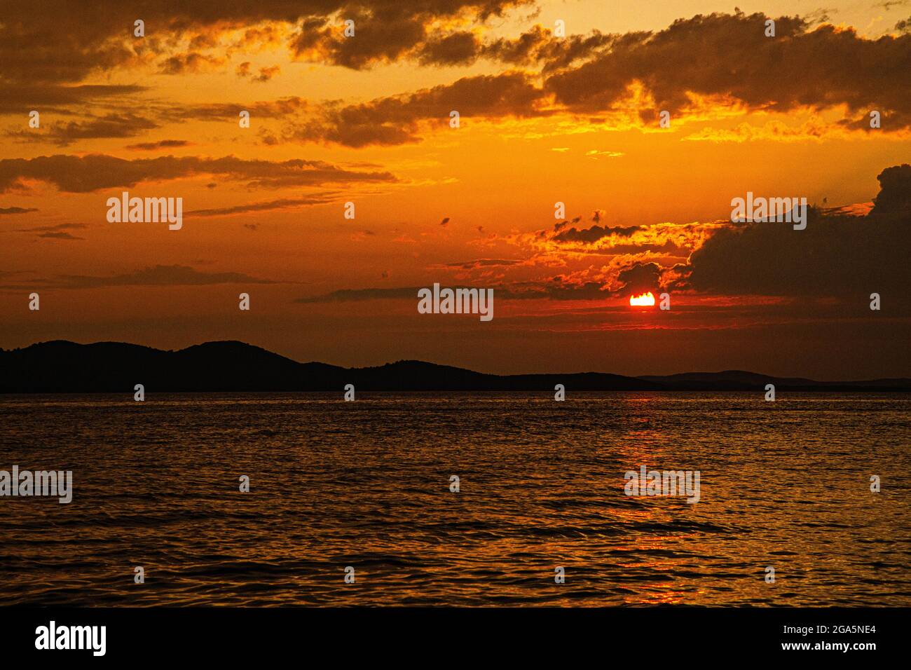 Sunset of orange and yellow colors in the city of Zadar on the Adriatic ...