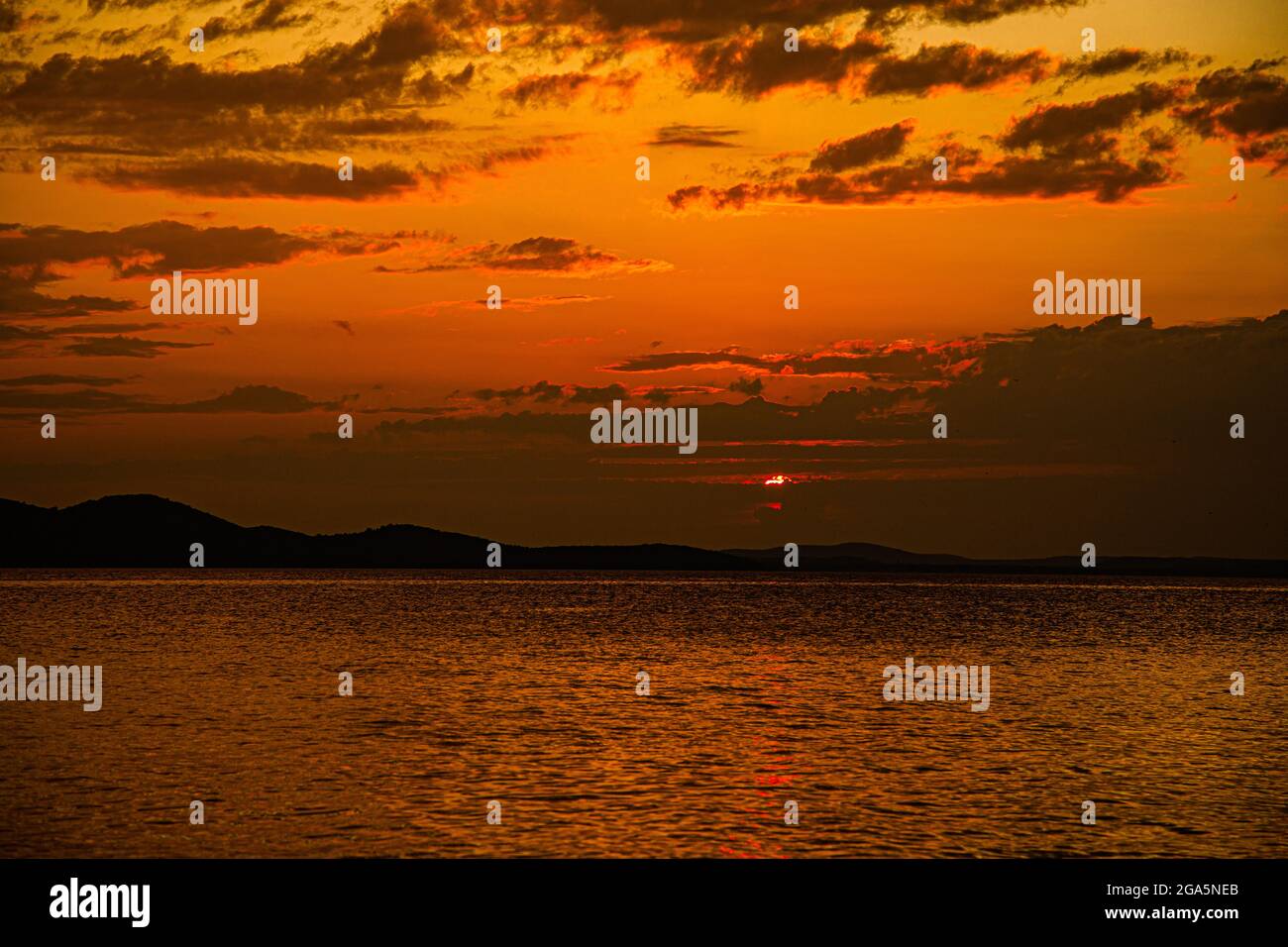 Sunset of orange and yellow colors in the city of Zadar on the Adriatic ...