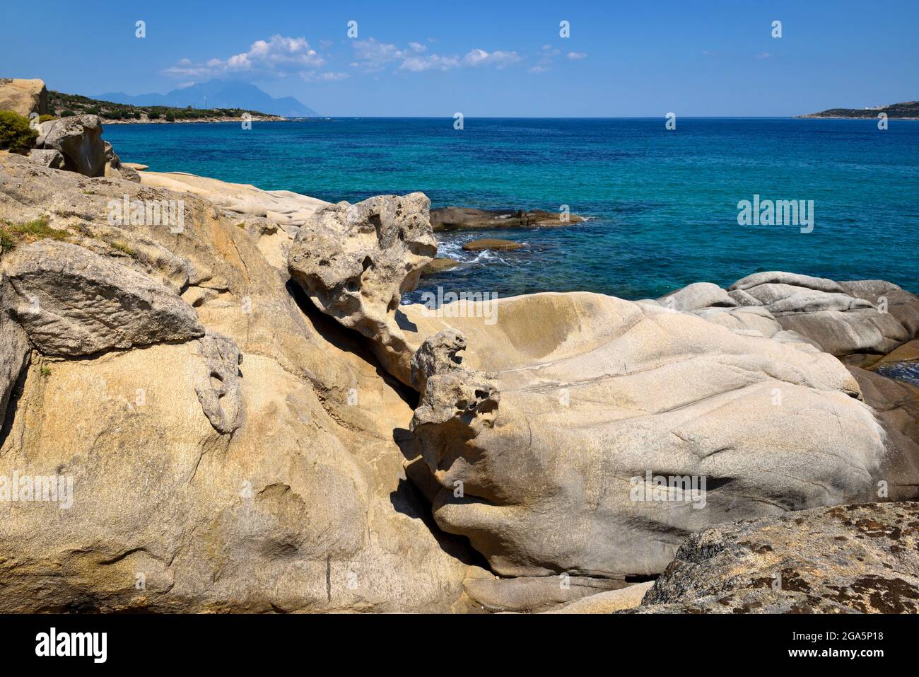 Beautiful seascape with stones and translucent blue water Stock Photo ...