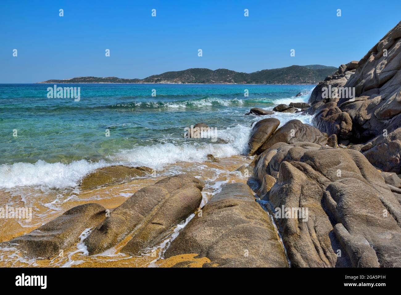Beautiful seascape with stones and translucent blue water Stock Photo ...