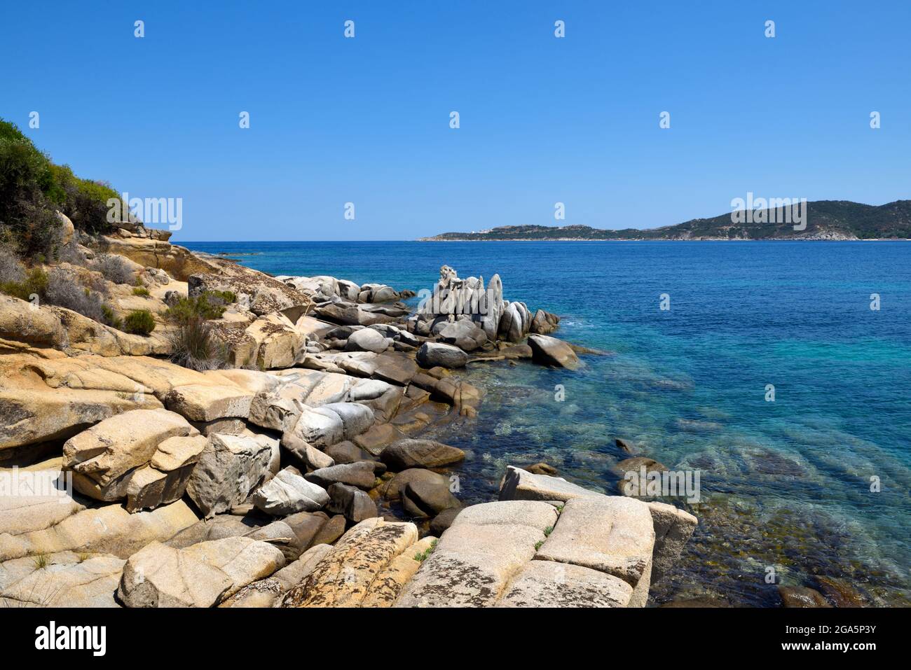 Beautiful seascape with stones and translucent blue water Stock Photo ...