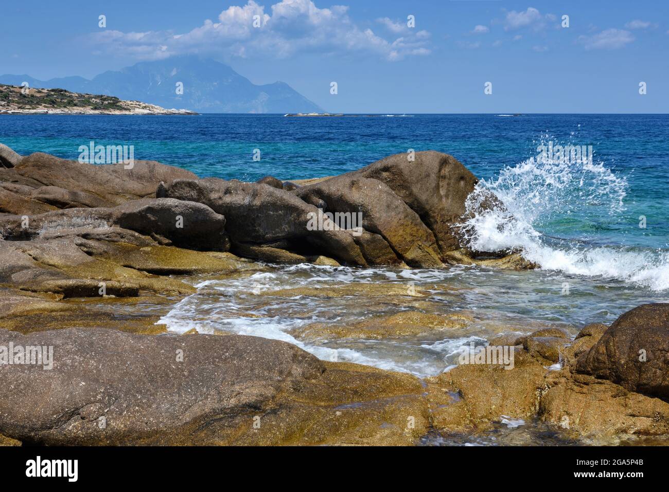 Beautiful seascape with stones and translucent blue water Stock Photo ...