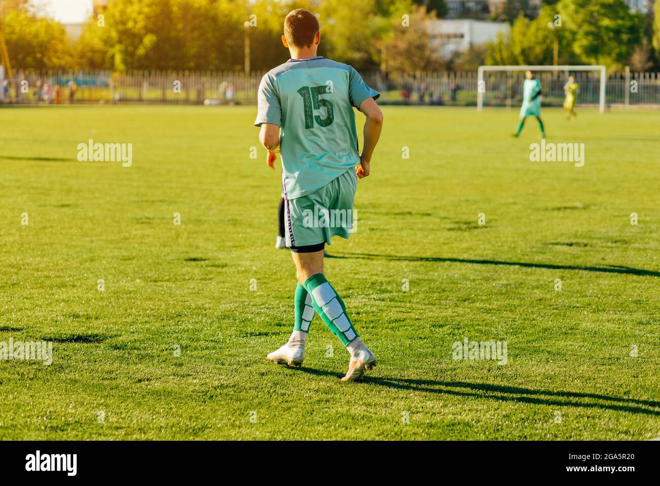 Football player stadium hitting ball hi-res stock photography and ...