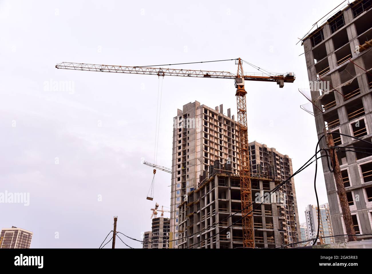 Tower crane on construction of a residential building. Cranes on ...