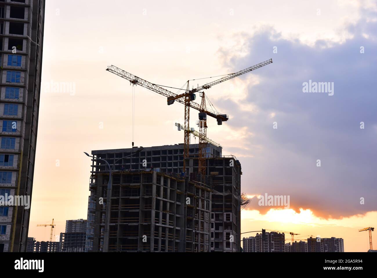 Tower crane on construction of a residential building. Cranes on ...