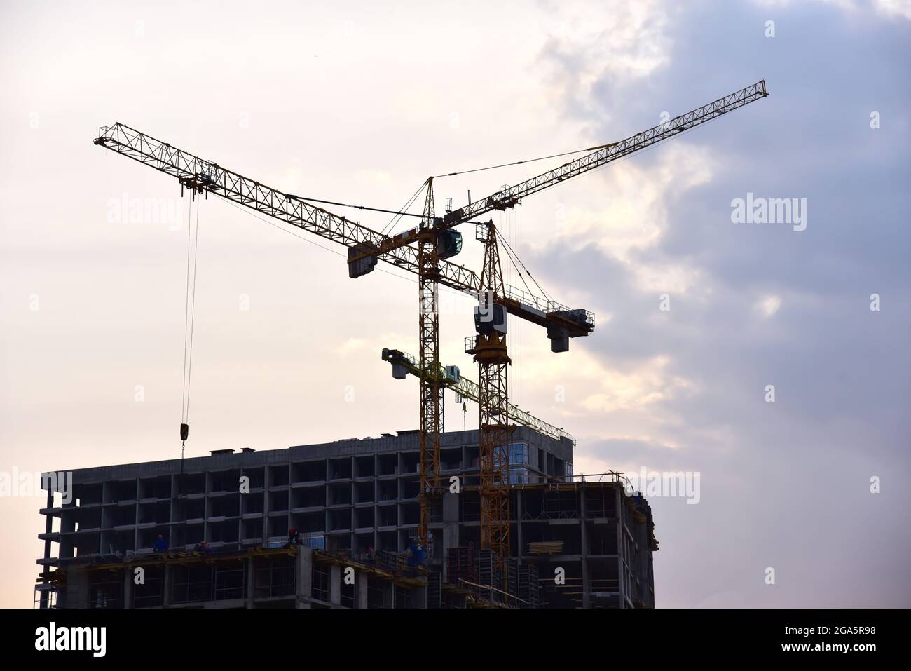 Tower crane on construction of a residential building. Cranes on ...
