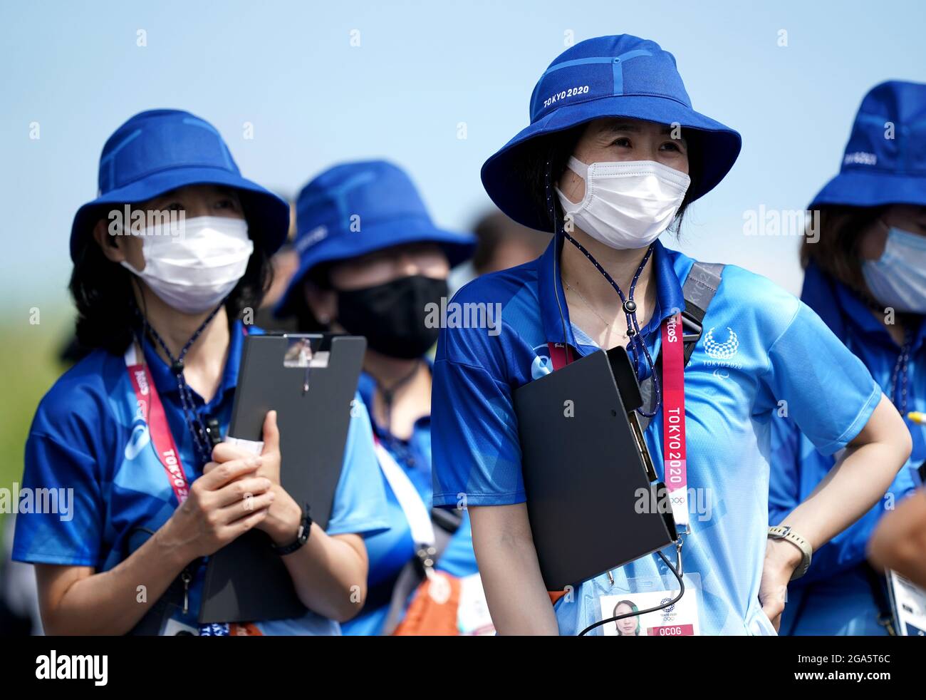 Officials watch the action during the Trap Men's final at Asaka ...