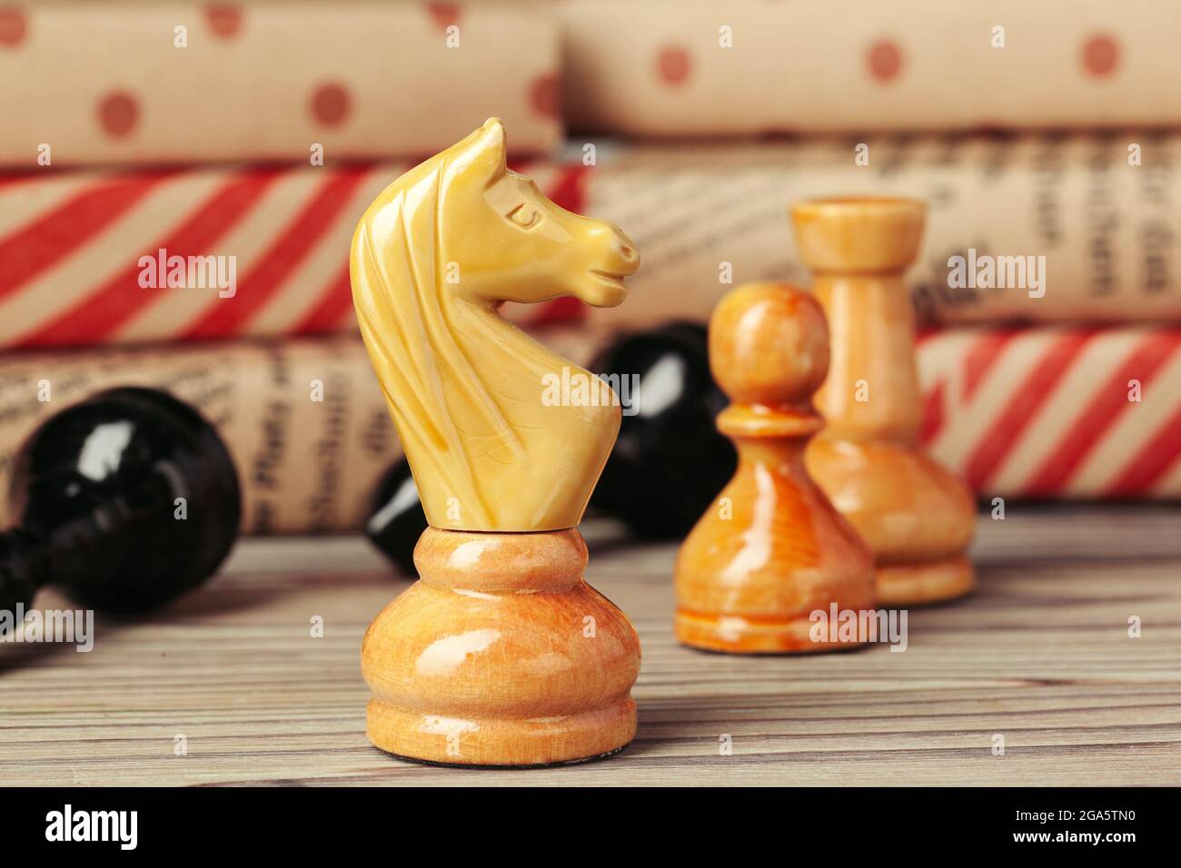 chess figures on brown woden table background Stock Photo - Alamy