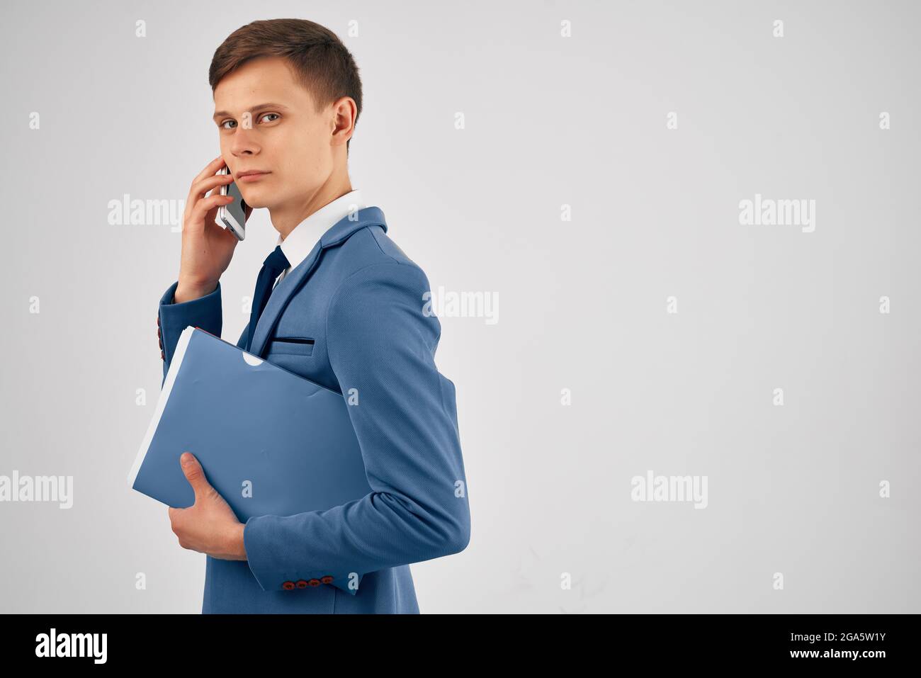 business man with blue folder talking on the phone manager professional ...