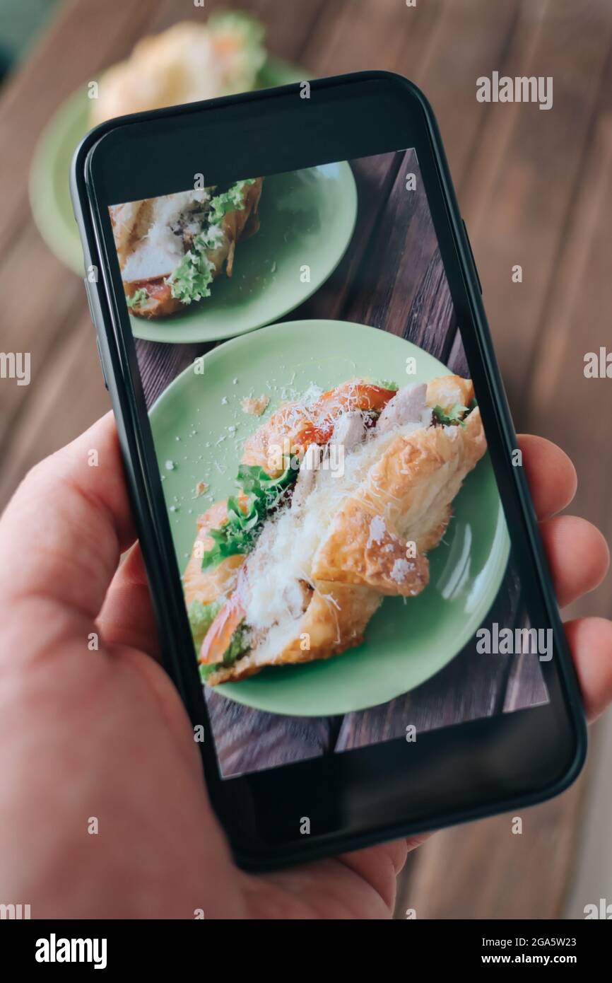 Man takes croissant hand hi-res stock photography and images - Alamy