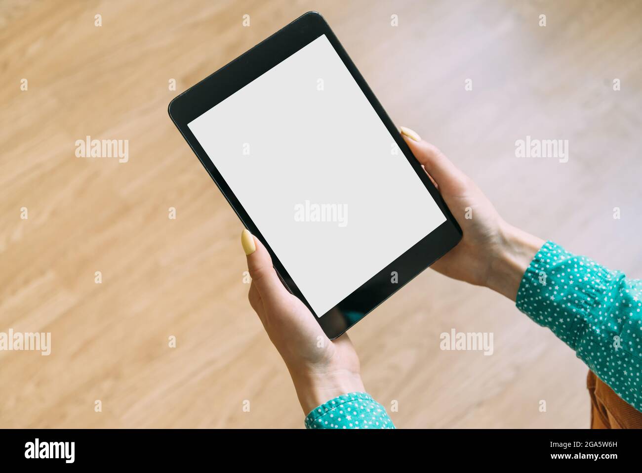 Unrecognizable woman holding a tablet Stock Photo - Alamy