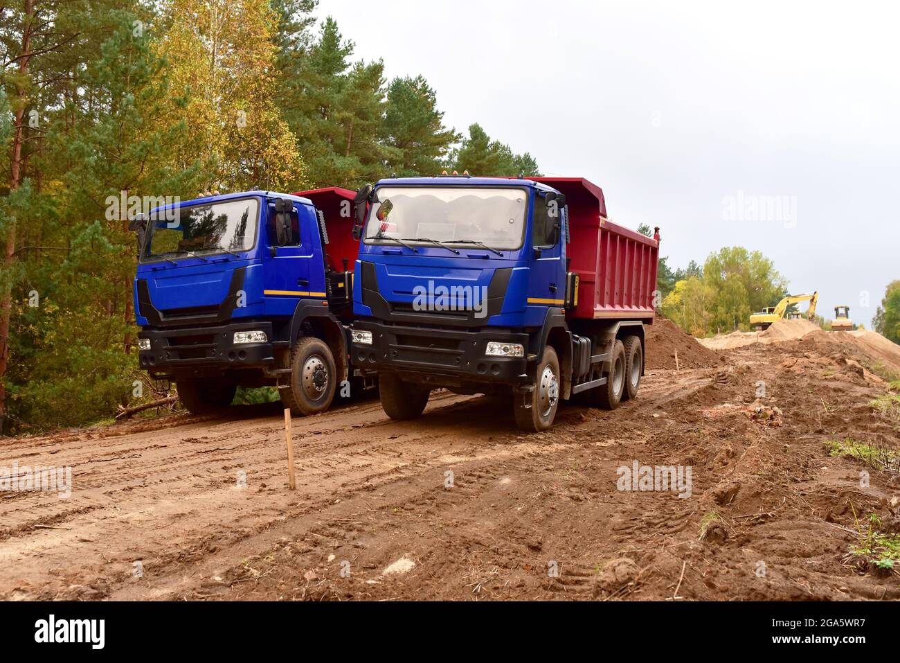 Excavator on a dumping ground hi-res stock photography and images - Alamy
