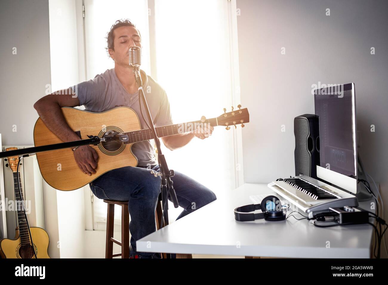 guitar player recording at home studio Stock Photo - Alamy