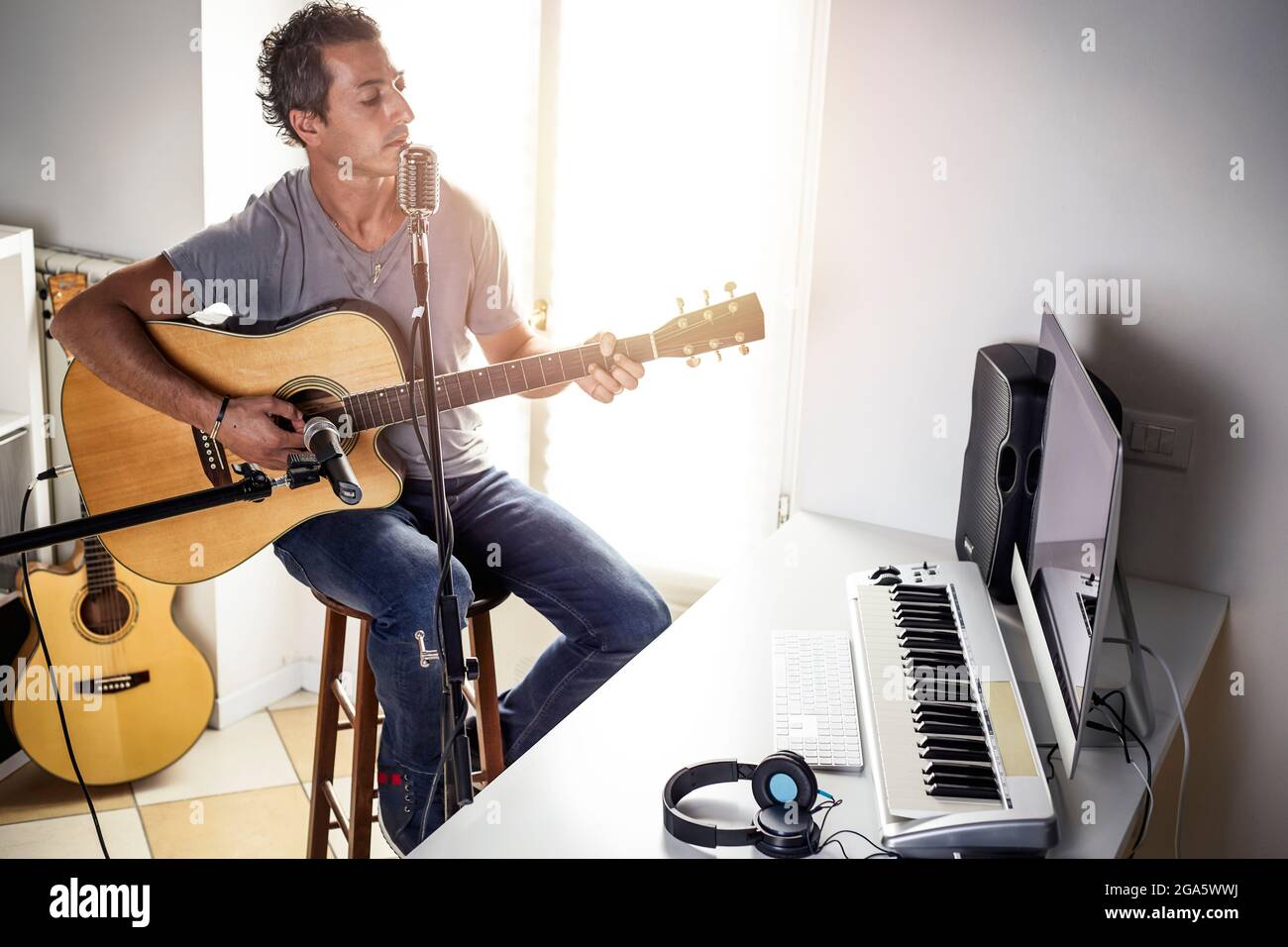 guitar player recording at home studio Stock Photo - Alamy
