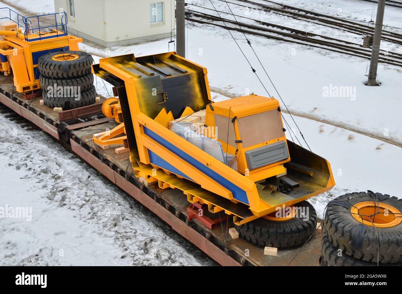 Yellow mining truck disassembled into parts, cab, body, electric motor ...