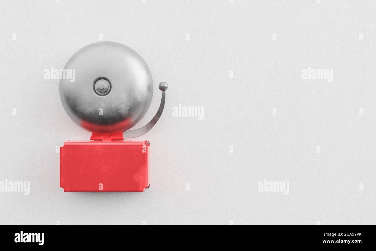 metallic school bell on white rough wall with space for text in concept ...