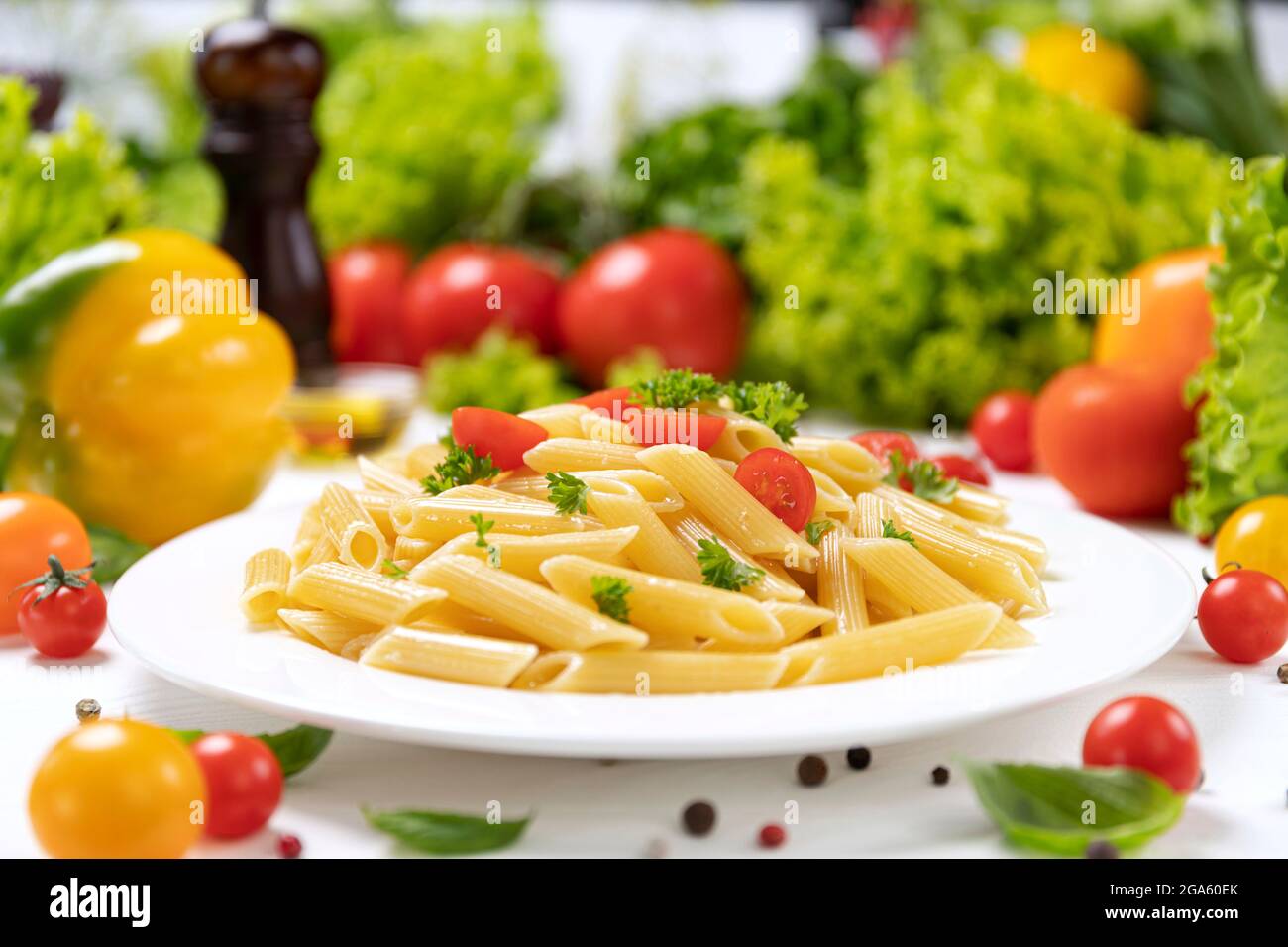 Plate of italian pasta, Penne rigate with tomatoes and basil Stock ...