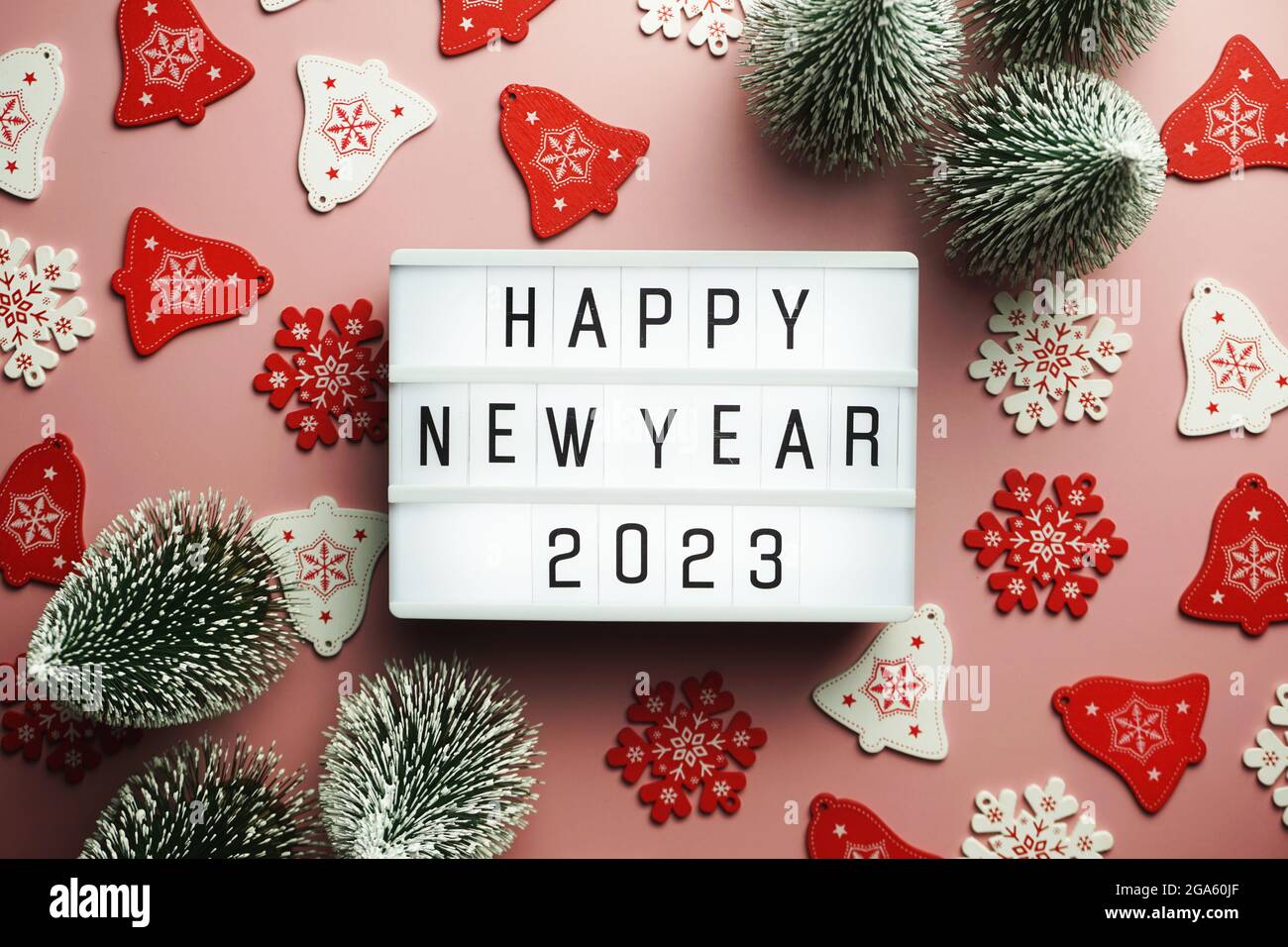 Happy New Year 2023 text in light box top view on pink background Stock ...