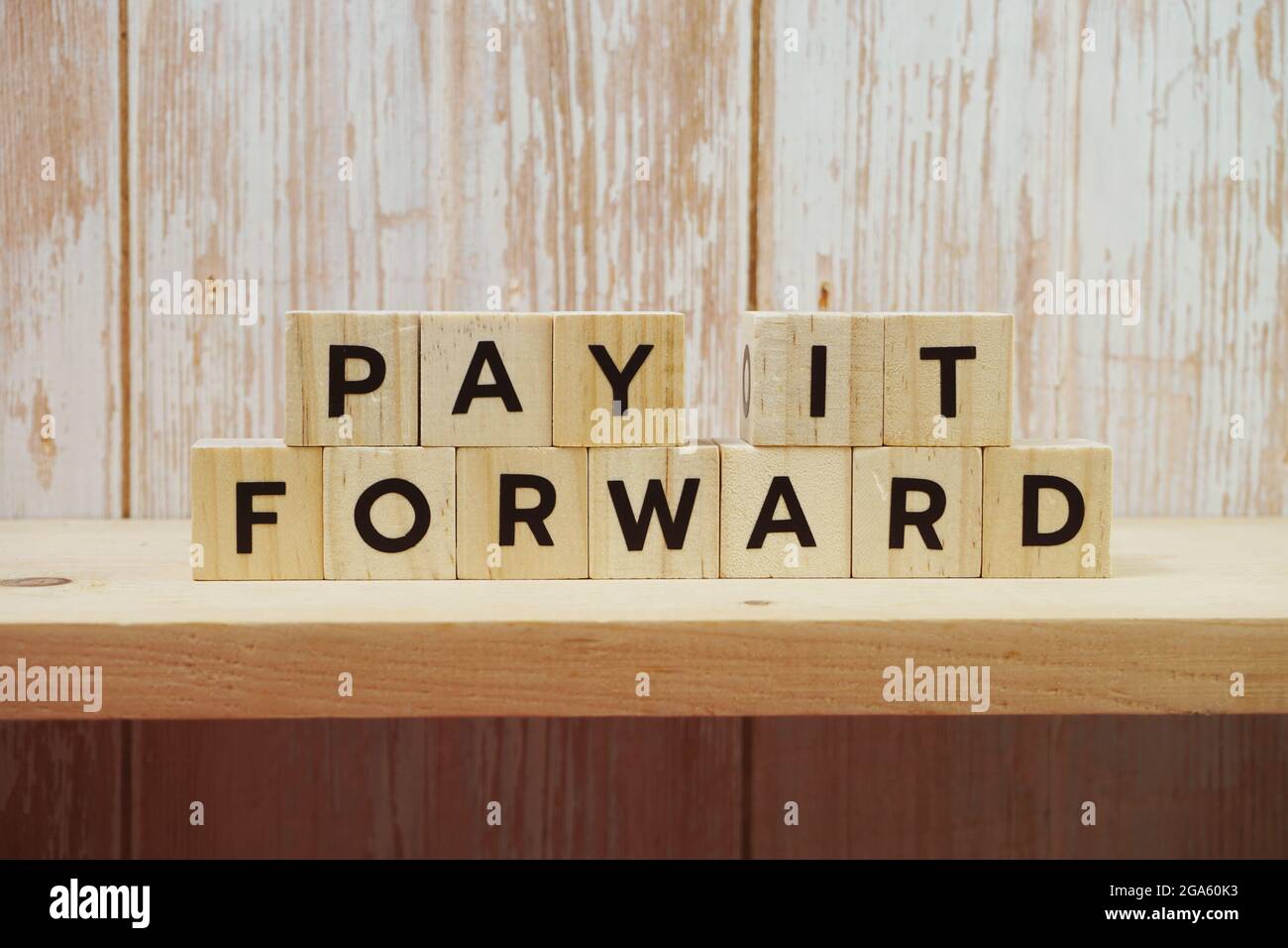 Pay It Forward alphabet letters with space copy on wooden shelf Stock ...