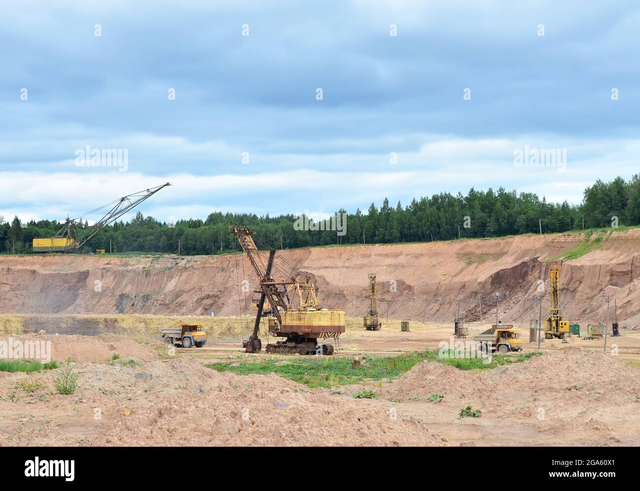Excavators, mining trucks, wheel loader and bulldozer work in dolomite ...