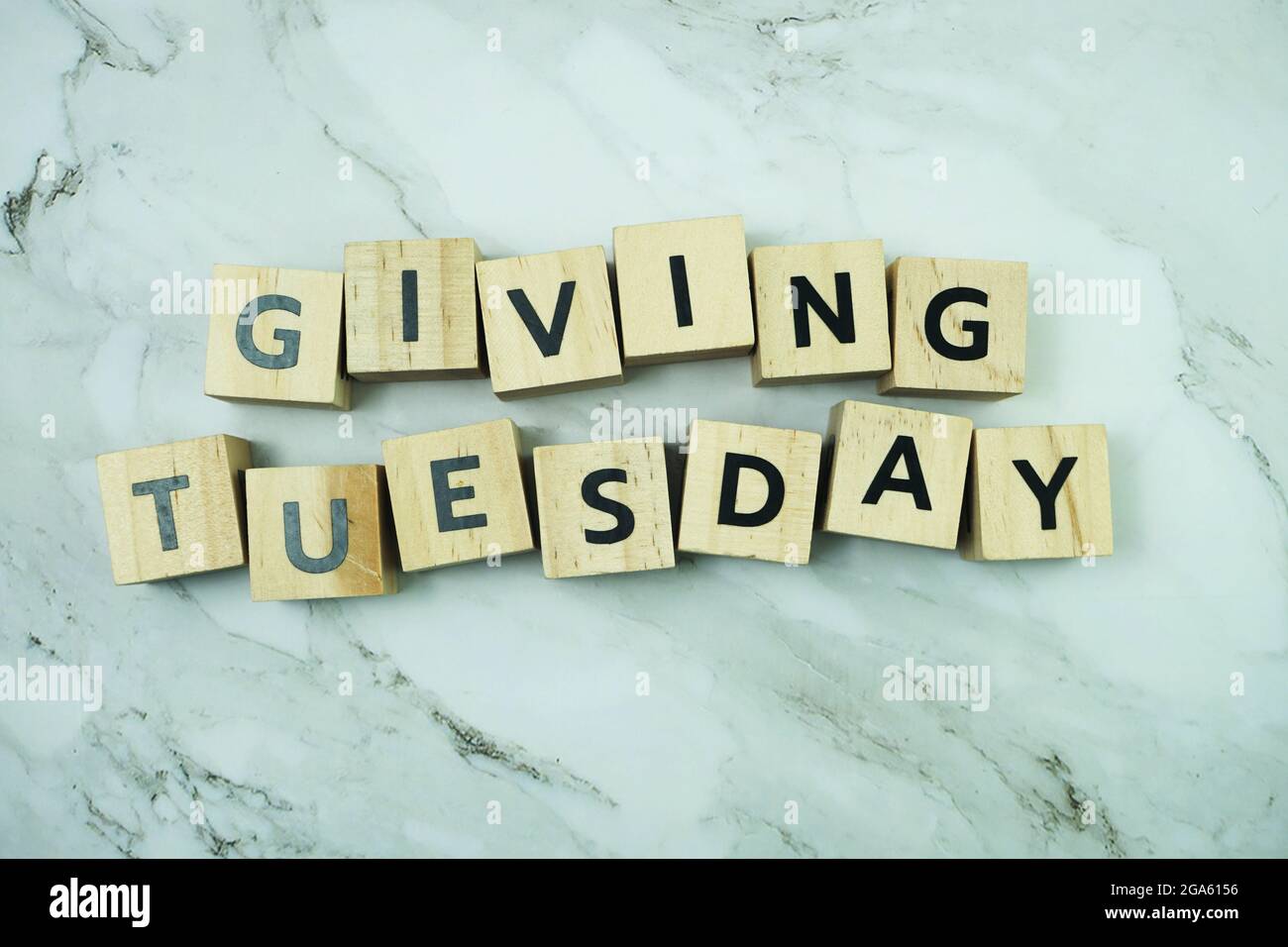 Top view of Giving Tuesday alphabet letters on marble background Stock ...