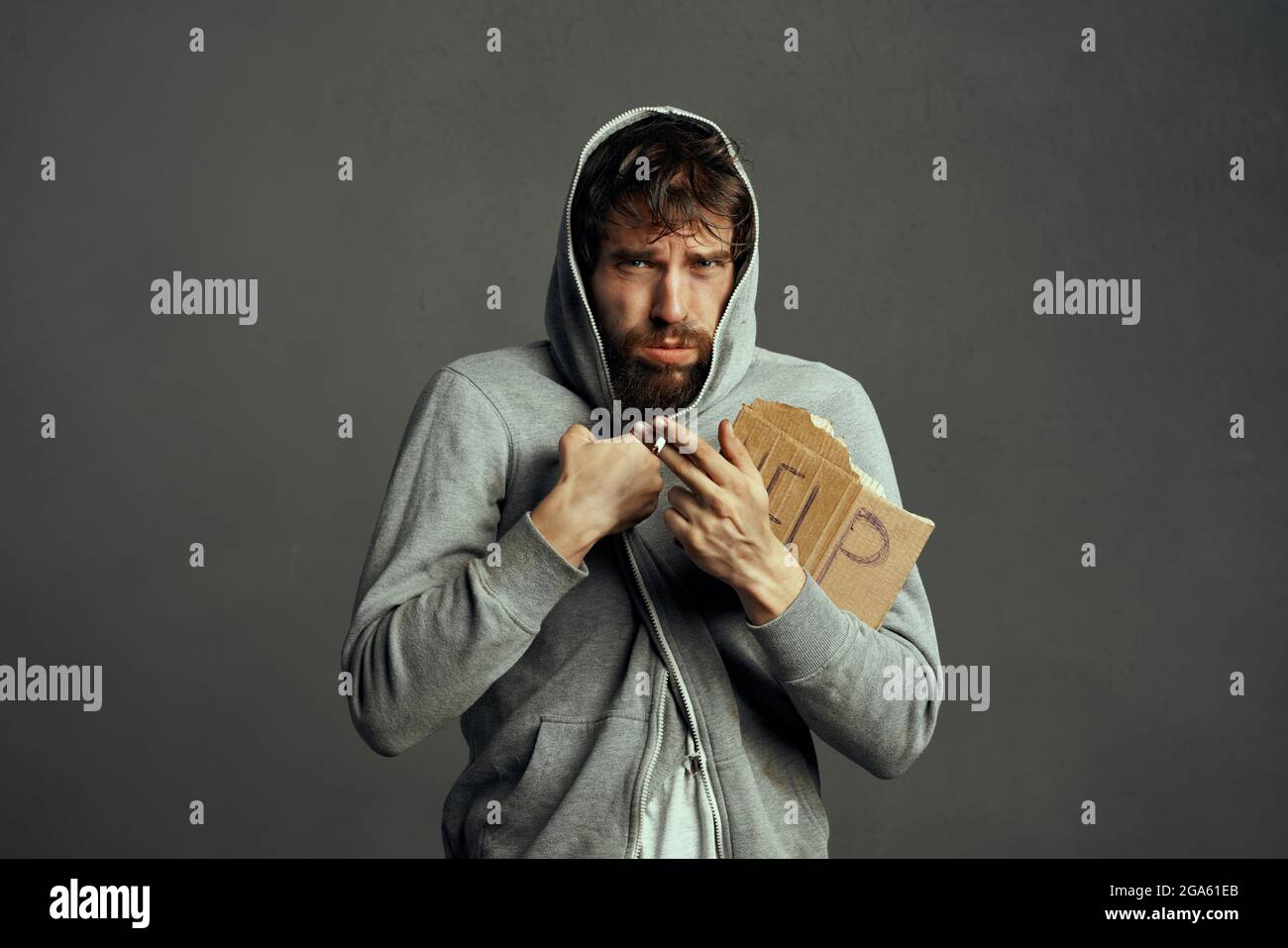 bearded homeless man holding a sign help financial problems bum Stock ...