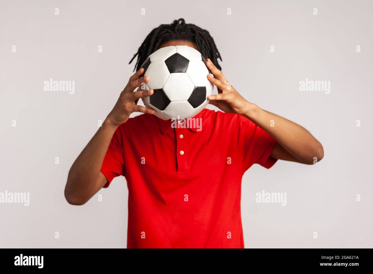 Soccer player covering his face with his shirt hi-res stock photography ...