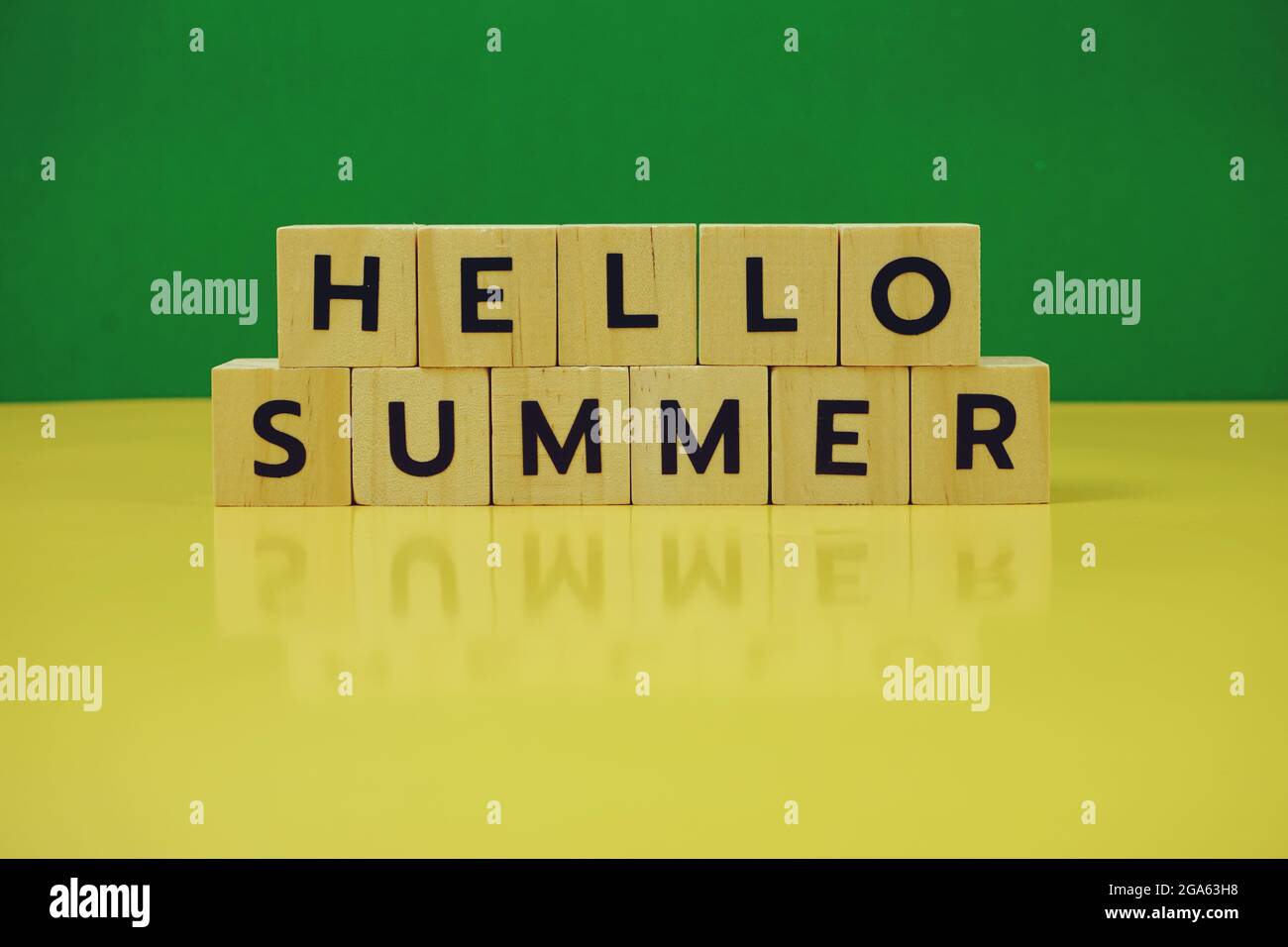 Hello Summer alphabet letter on green and yellow background Stock Photo ...