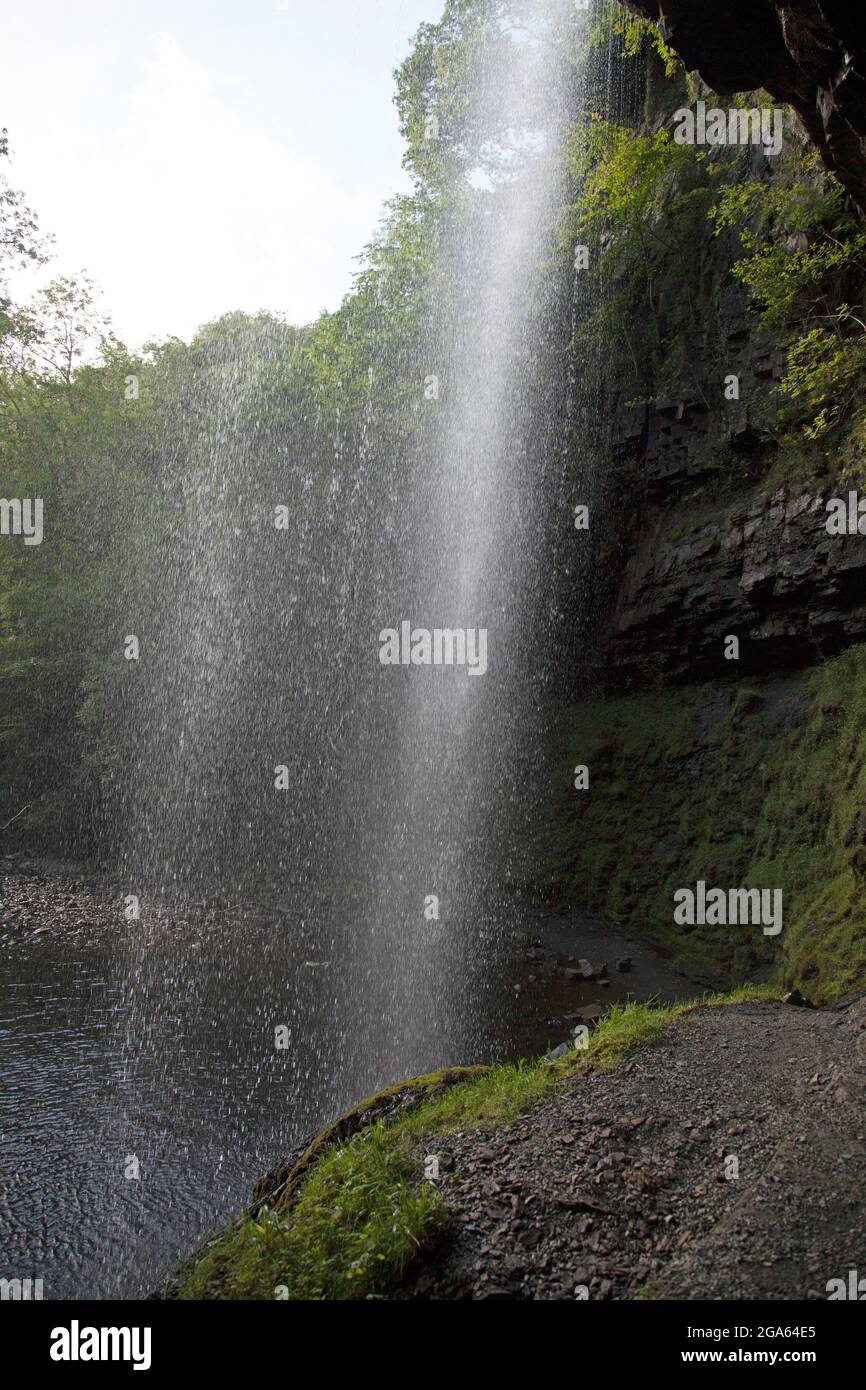 Photograph taken looking out from behind Henrhyd waterfalls, Neath, the ...