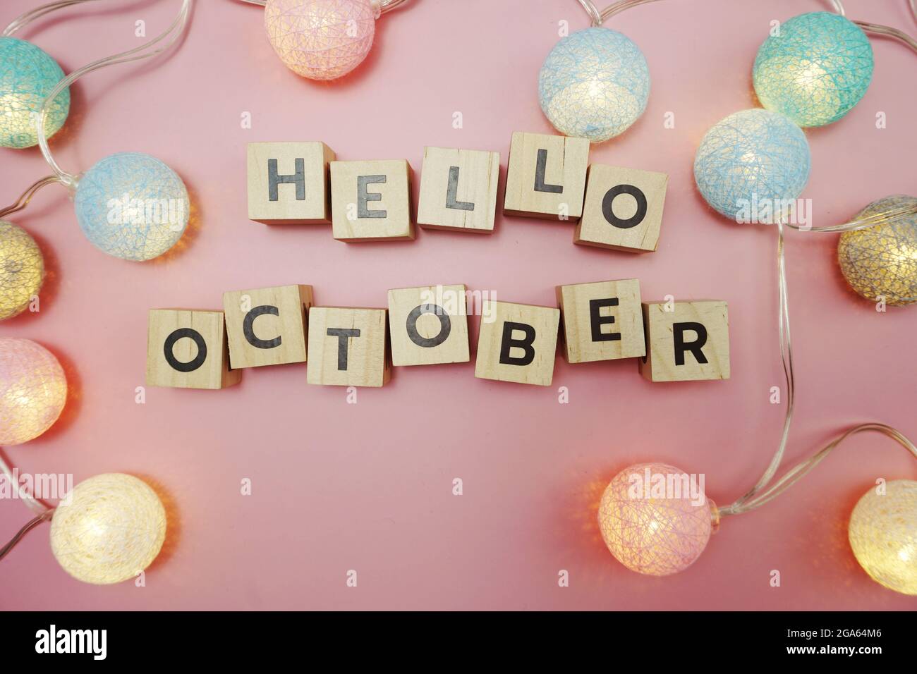 Hello October alphabet letters with LED cotton balls decoration on pink ...