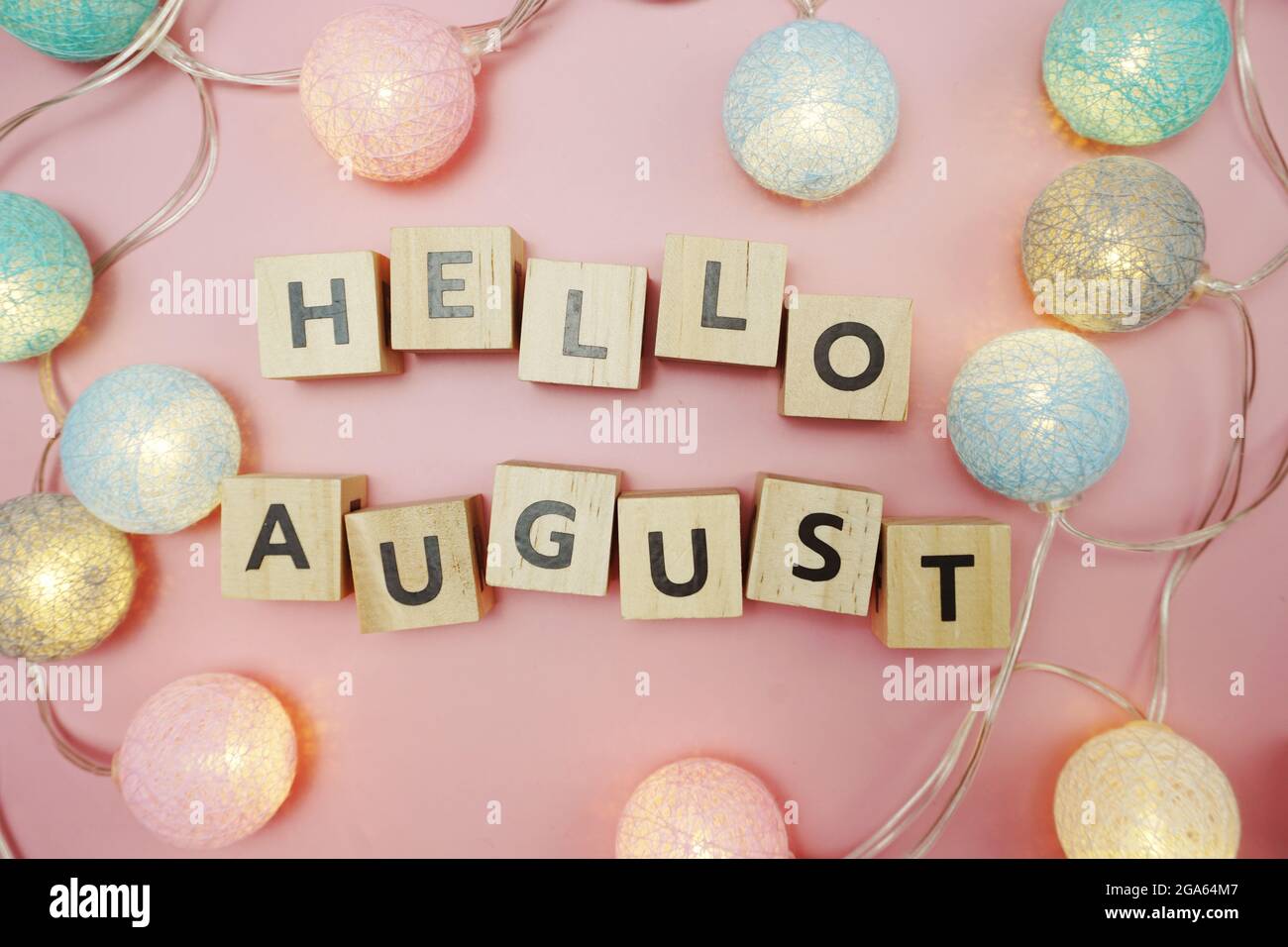 Hello August alphabet letters with LED cotton balls decoration on pink ...