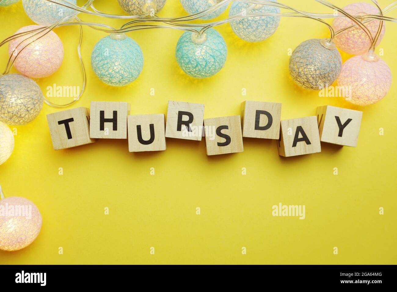 Thursday alphabet letters with LED cotton balls decoration on yellow ...