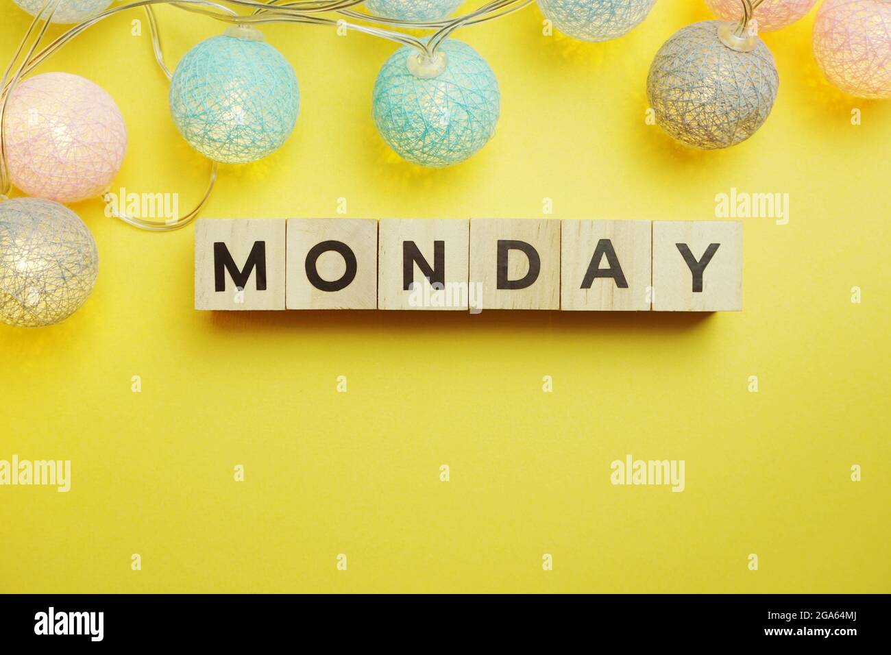 Monday alphabet letters with LED cotton balls decoration on yellow ...