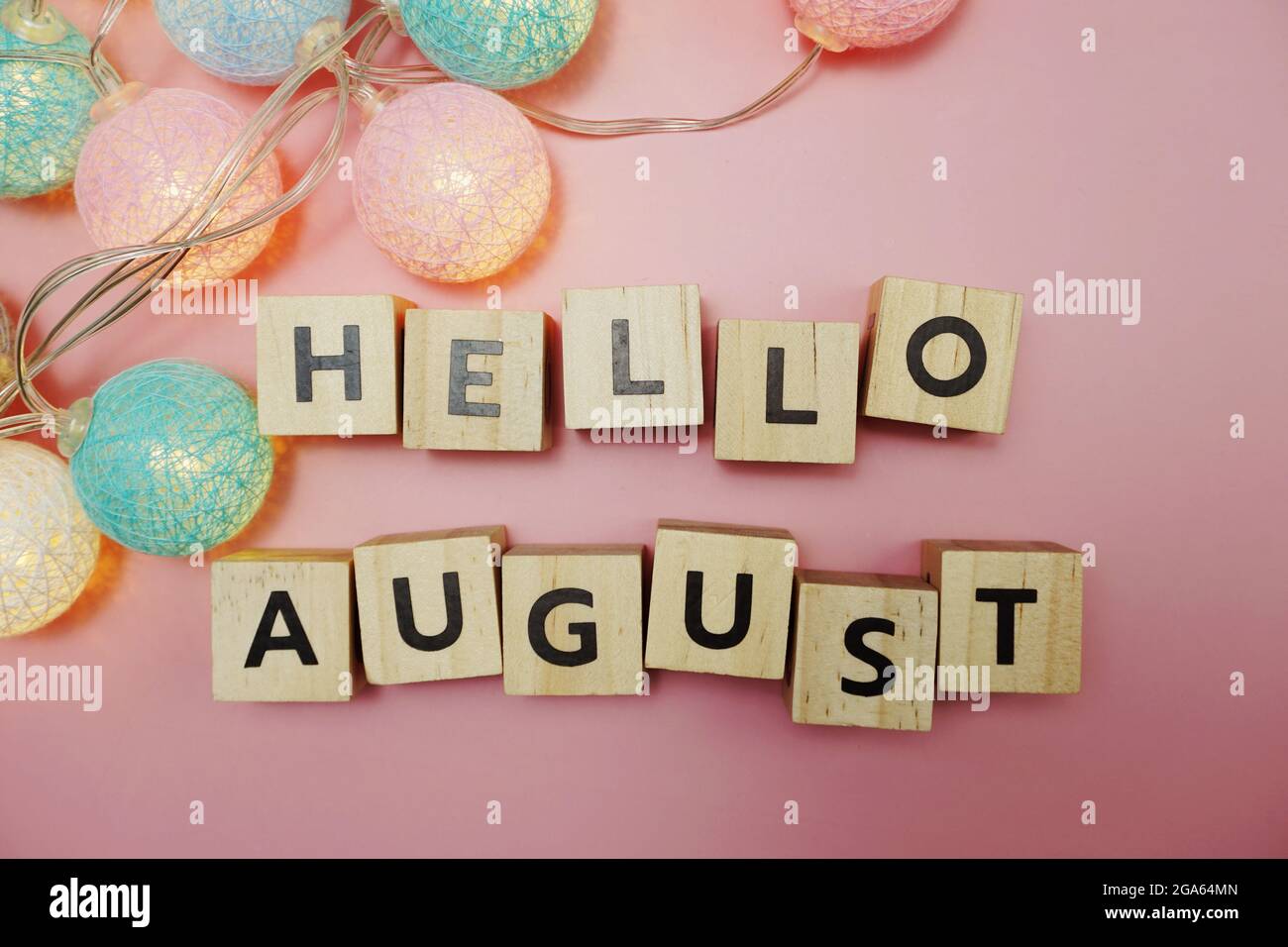Hello August alphabet letters with LED cotton balls decoration on pink ...