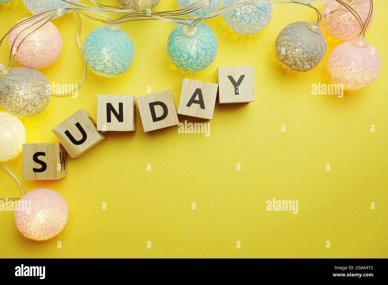 Sunday alphabet letters with LED cotton balls decoration on yellow ...